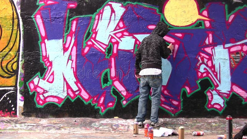 Painter in Jeans and a Hood and Stock Video - Video of colourful ...