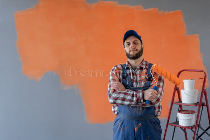 Painter Man with Crossed Arms Holding Paint Roller Looking at Camera ...
