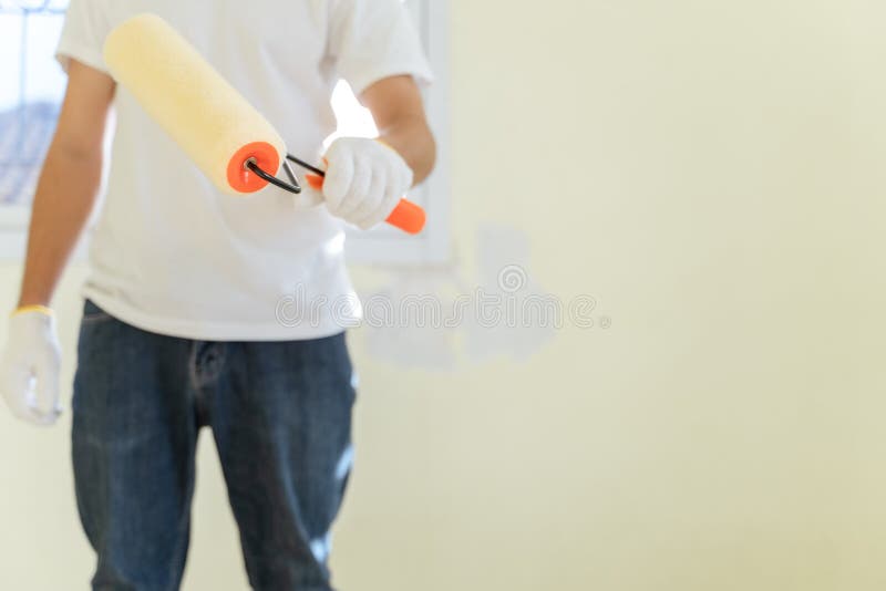 Painter Man Hands with Gloves Holds Painting Roller for Renovation ...