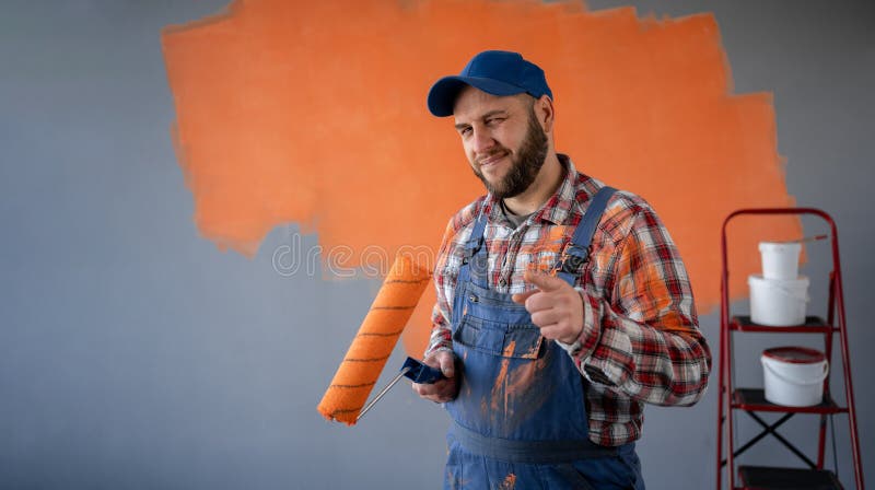 Painter Man Holding a Paint Roller Pointing Front with Happy Expression ...