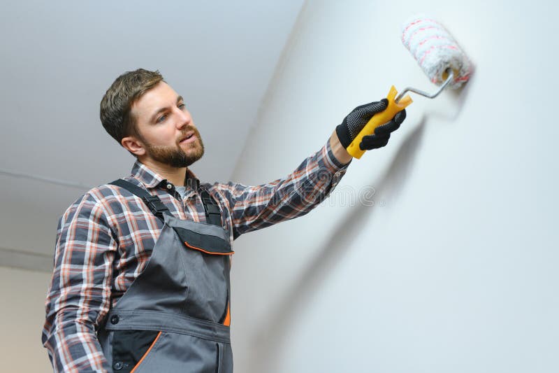 Painter Man Painting the Wall, with Paint Roller Stock Image - Image of ...