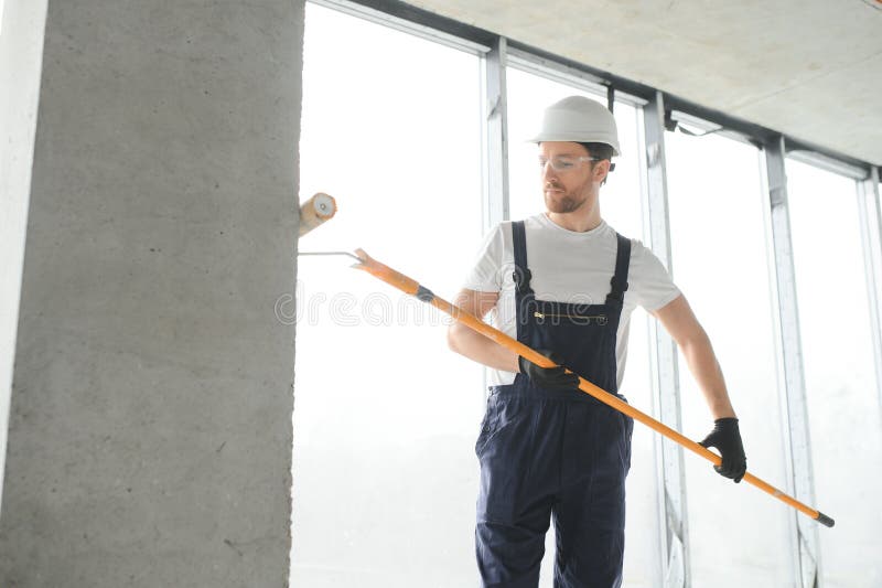 Painter Man Painting the Wall, with Paint Roller. Stock Image - Image ...