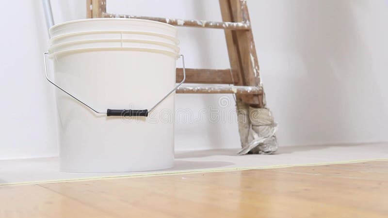 Painter Man at Work, Rests the Paint Roller in the Bucket Stock Video ...
