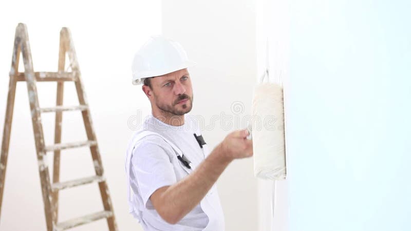 Painter Man at Work, with Roller Painting Wall, Painter House Stock ...