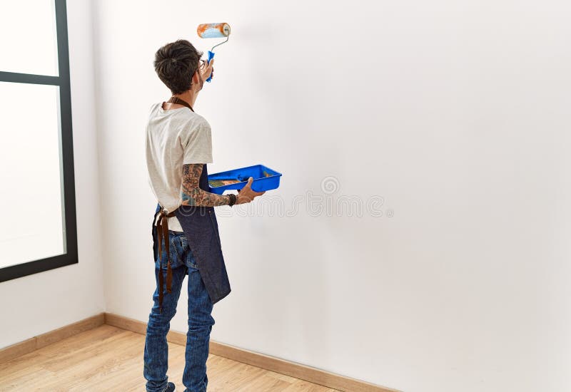 Painter Painting Wall Using Roller at Home Stock Image - Image of ...