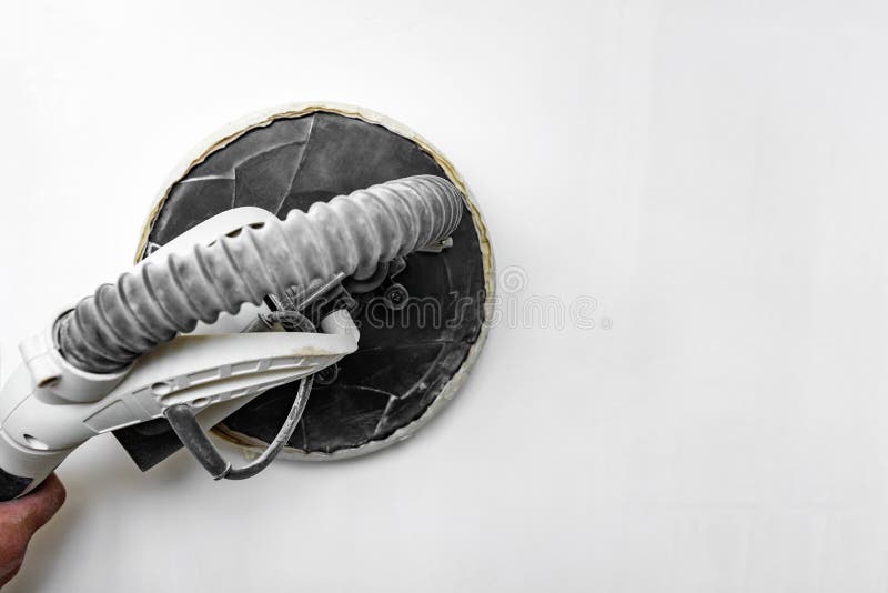 Painter Polishing and Sanding Wall Surface after Putty for Painting in ...