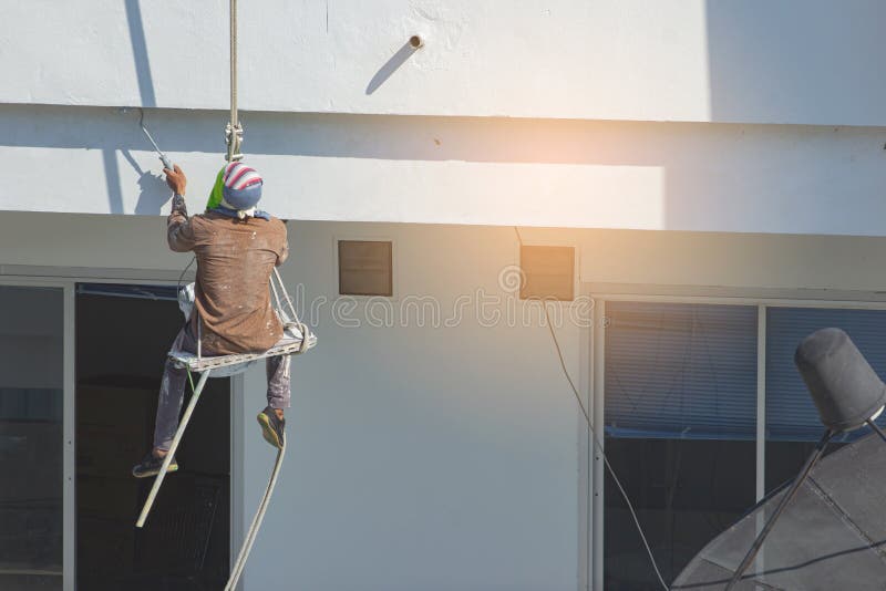 The Painter Renovated and Painted High-rise Buildings. Editorial ...