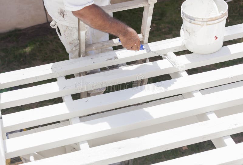 Painter Rolling White Paint Onto Top of Patio Cover Stock Image - Image ...