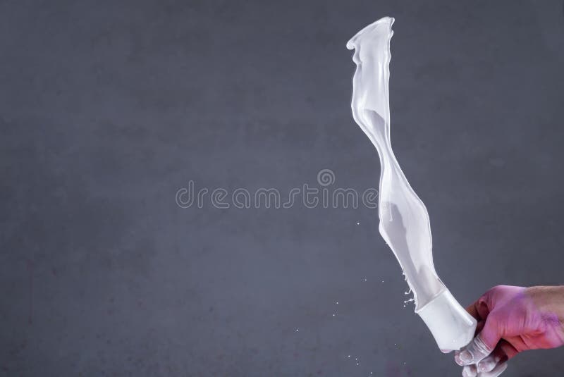Painter Throwing Paint Splash on Wall Creating Abstract Art Stock Photo ...