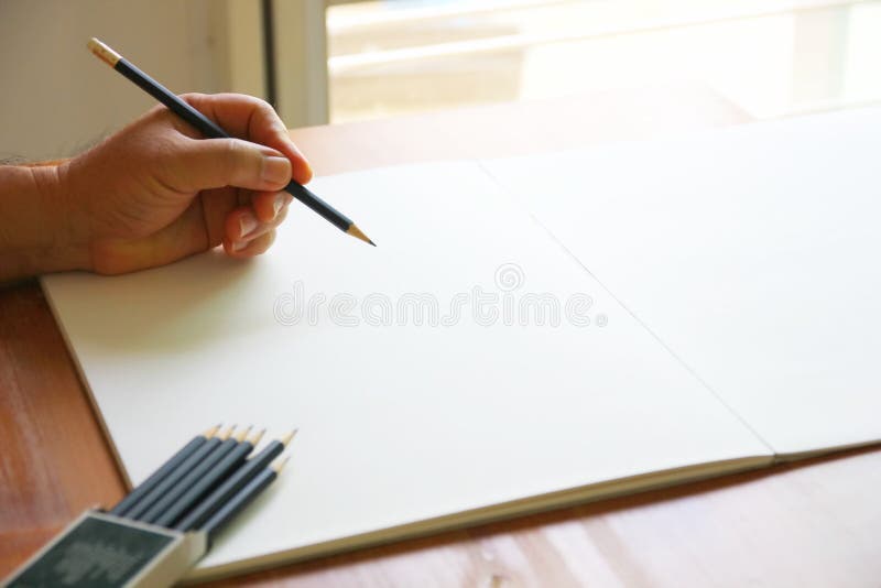 The Painter Using Black Pencil Sketch on White Paper Stock Image ...