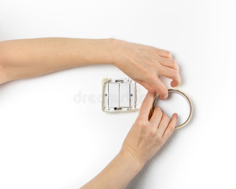 Painter Using Masking Yellow Tape To Secure Light Switch Stock Image ...