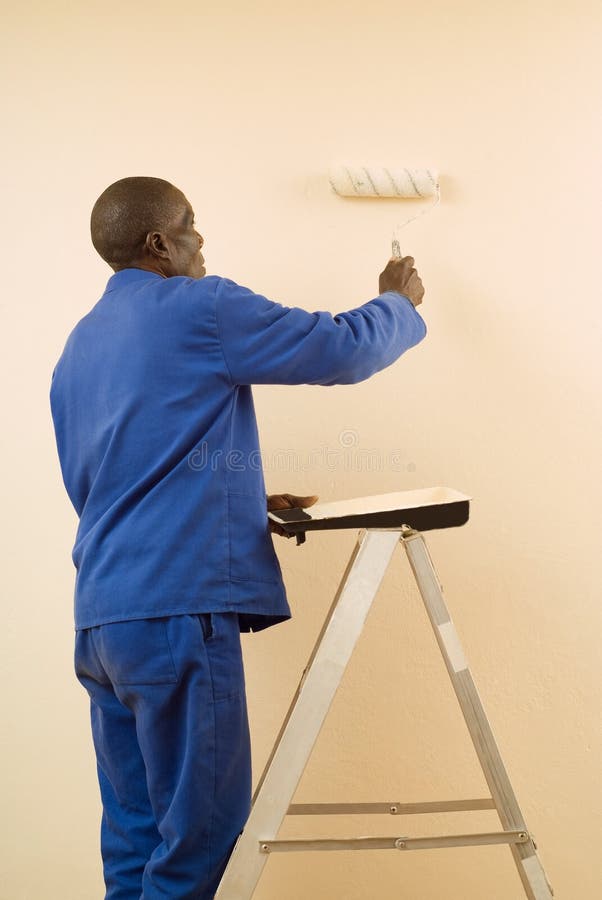Painter Using a Paint Roller Stock Photo - Image of renovations, home ...