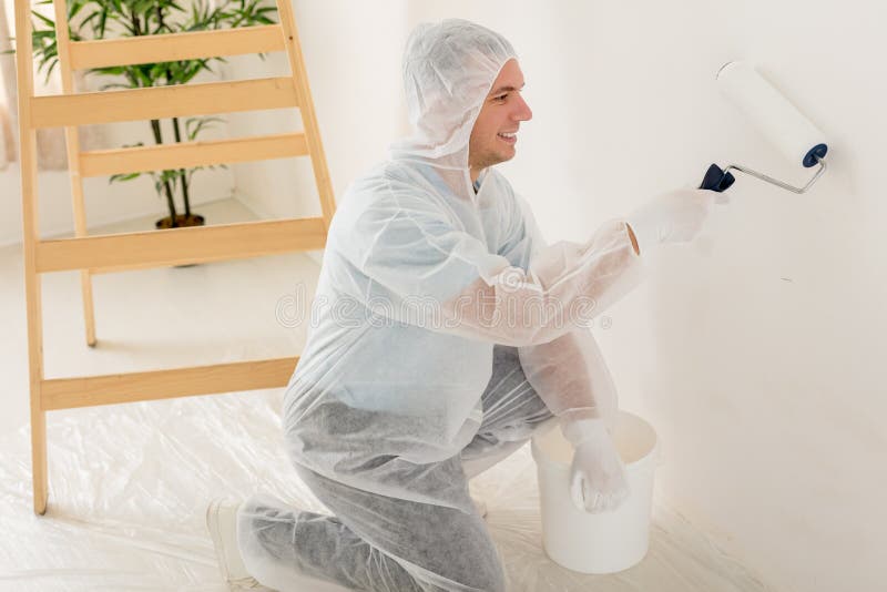 One Guy Whitewashing the Wall for Room Renovation Stock Image - Image ...