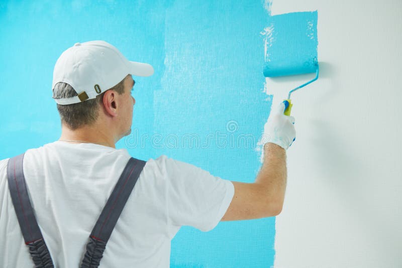 Painter Worker with Roller Painting Wall Surface into Color Stock Photo ...