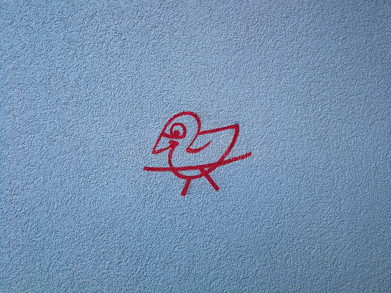 Painting of a Bird in Red Paint on a Blue Azure Wall Stock Image ...