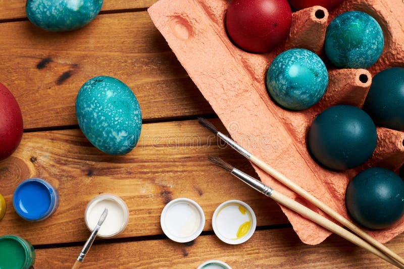 Painting Eggs. Paints and Brushes for Coloring Eggs for Holiday Stock ...