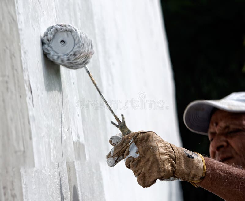 Painting the facade stock photo. Image of outside, hardhat - 33440634