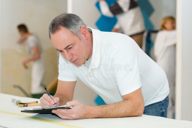 Painting Foreman Writing on Clipboard Stock Photo - Image of grading ...