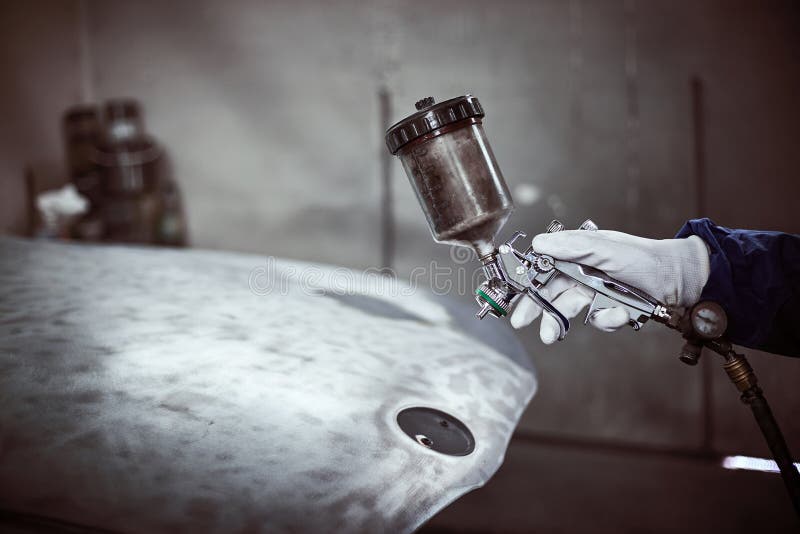Painting the Machine in the Chamber with a Pneumatic Tool on the Stock ...