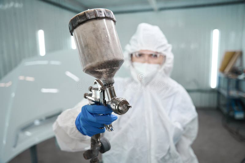 Painting Master with a Paint Injection Tank in Her Hands Stock Photo ...