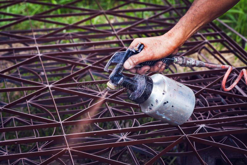 Painting the steel frame. stock photo. Image of hand - 94215228