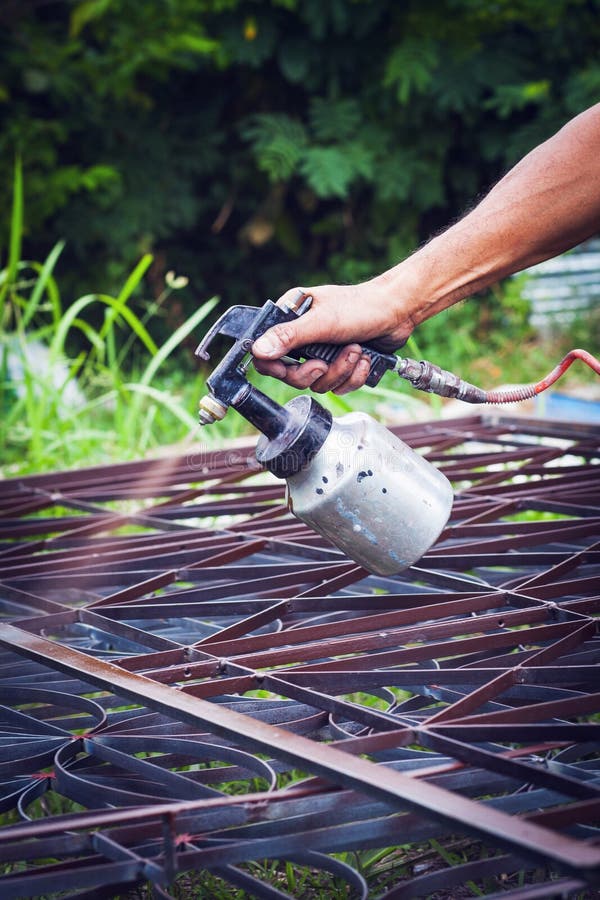 Painting the steel frame. stock image. Image of painter - 94215305