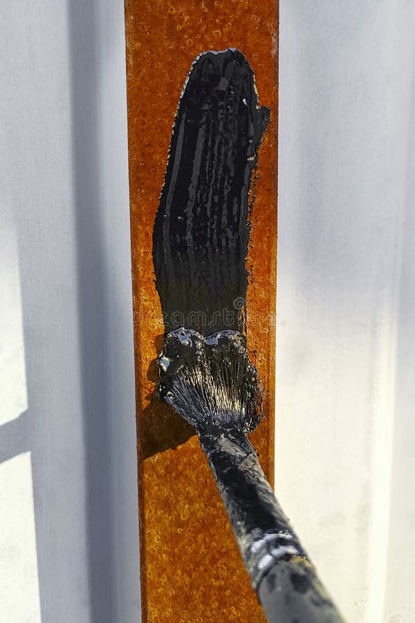 Painting the Surface with a Brush. Painting Rusty Metal. Close-up ...
