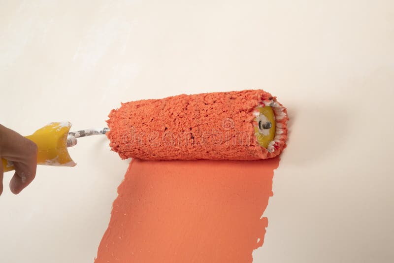 Painting the Wall Orange Color, Paint Roller Stock Image - Image of ...
