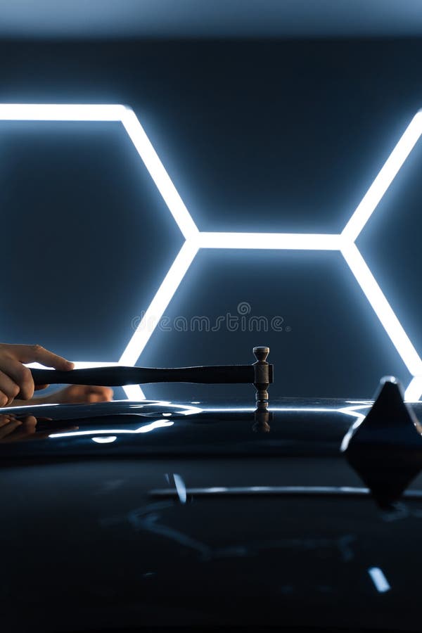 Paintless Dent Repair PDR Involves Tapping Dents Under Light Reflection ...