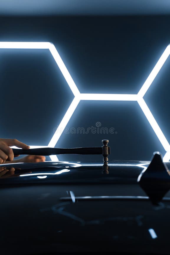 Paintless Dent Repair PDR Involves Tapping Dents Under Light Reflection ...