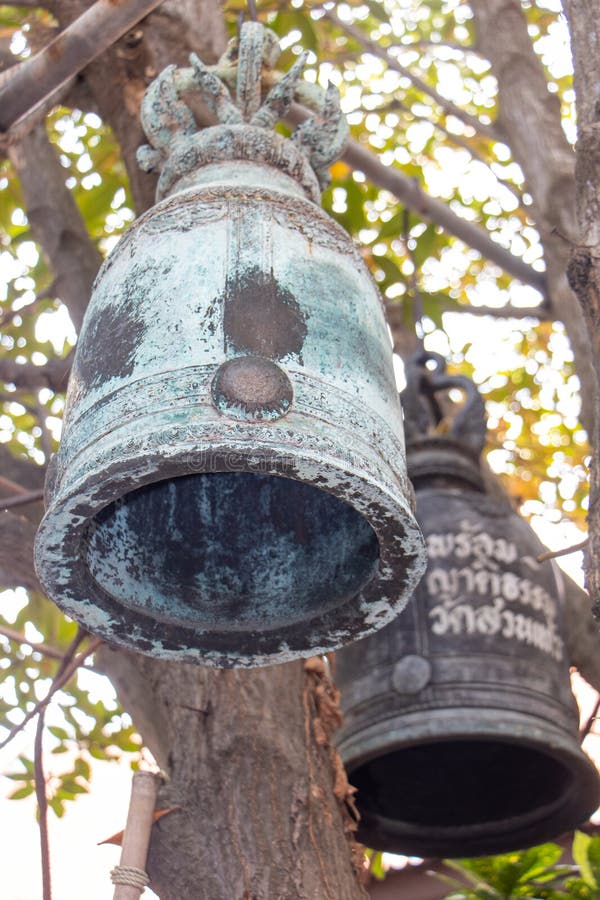 A Pair of Bells Hanging on a Construction in a Tree in a Buddhist ...