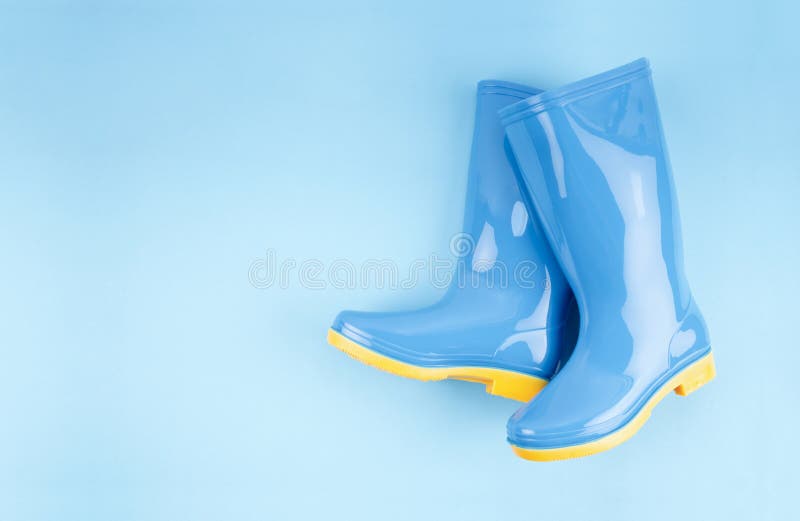 Pair of Blue Rubber Boots on Light Blue Background, Top View with Empty ...