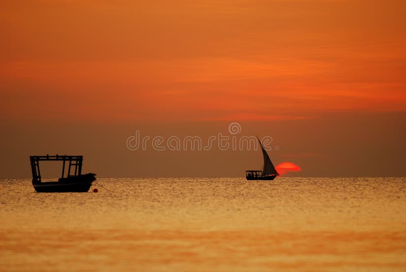 Pair of boats in sunset stock image. Image of clouds - 10847539