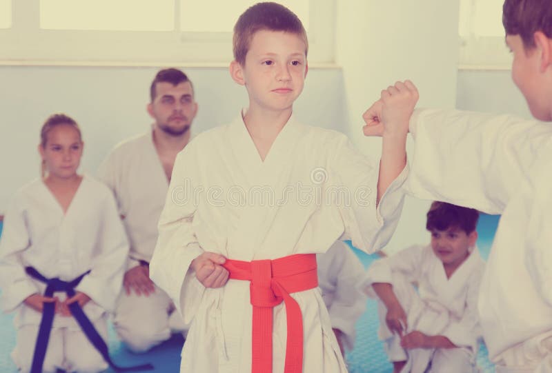 Teenage boys fighting stock image. Image of slim, stripes - 23314969