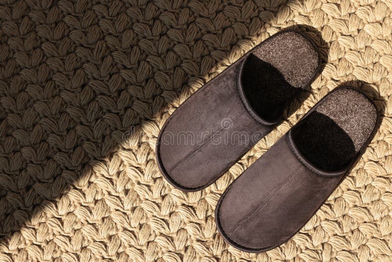 Pair of Brown Slippers on Carpet, Top View. Space for Text Stock Photo ...
