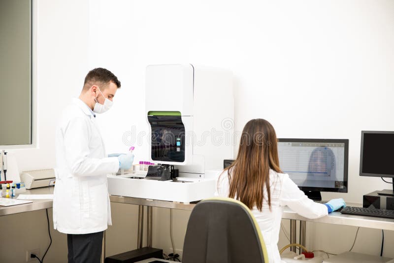 Pair of Chemists Working in a Laboratory Stock Image - Image of ...