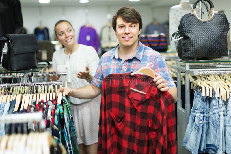 Pair Chooses Clothes at the Store Stock Image - Image of boutique ...