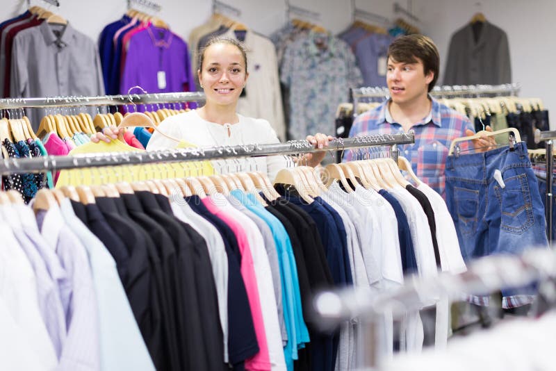 Pair Chooses Clothes at the Store Stock Photo - Image of fashion ...