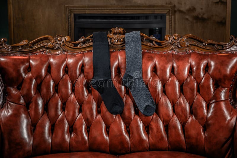 A Pair of Classic Socks on a Red Vintage Sofa Stock Photo - Image of ...