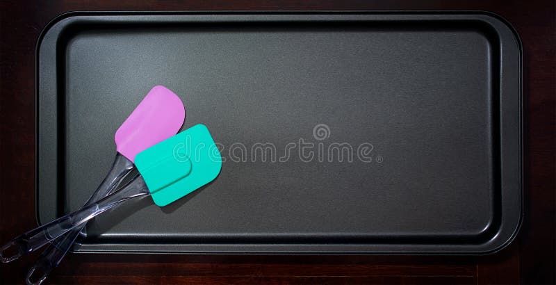 Pair of Colored Spatula on a Polytetrafluoroethylene Baking Tray Stock ...