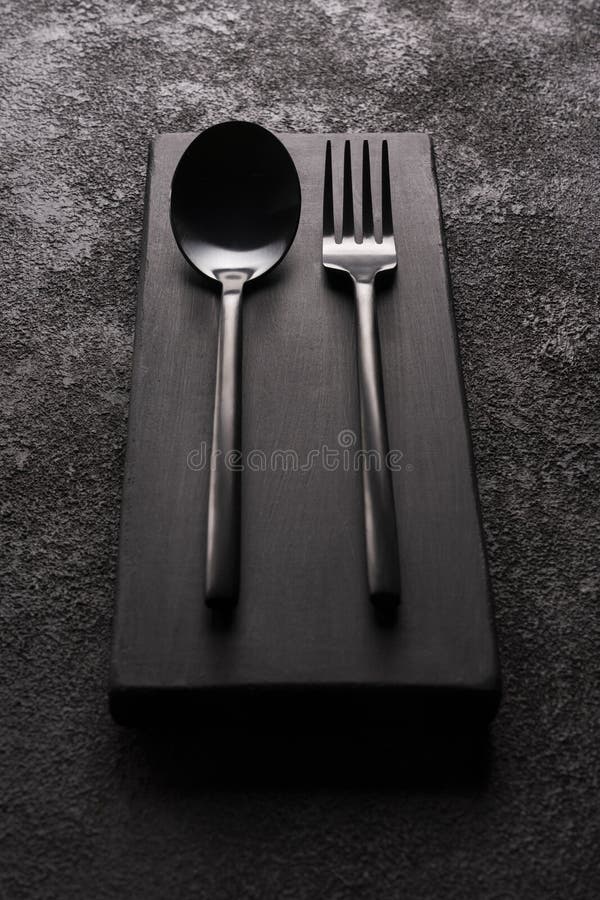 A Pair of Cutlery Set - a Black Spoon and Fork. Beautiful Shadow and ...