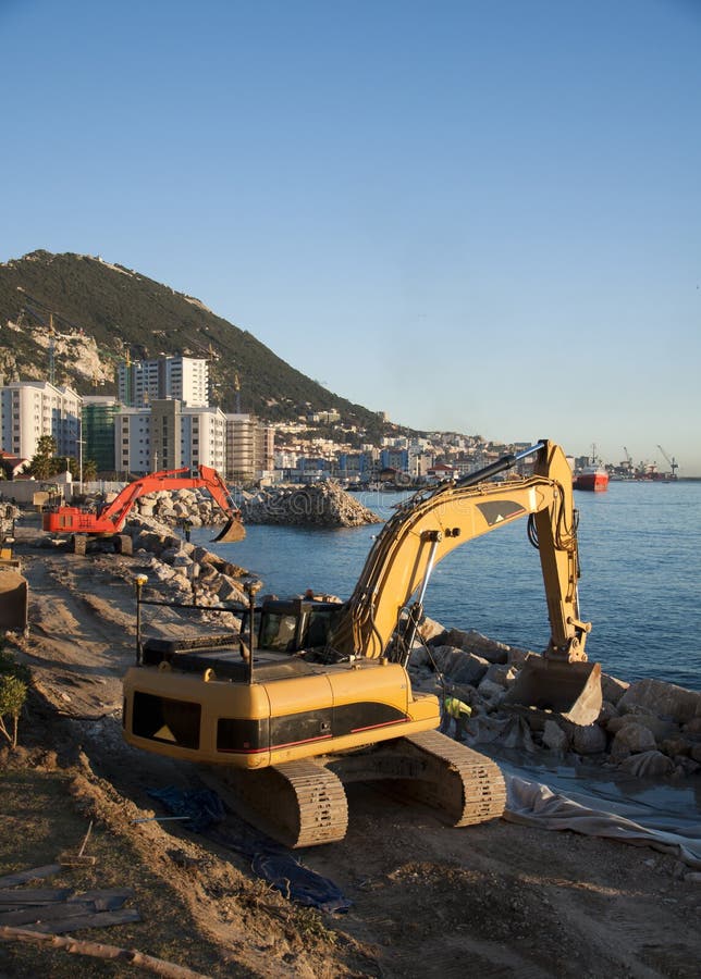 Pair of Diggers Working by the Shore Stock Photo - Image of cabin ...