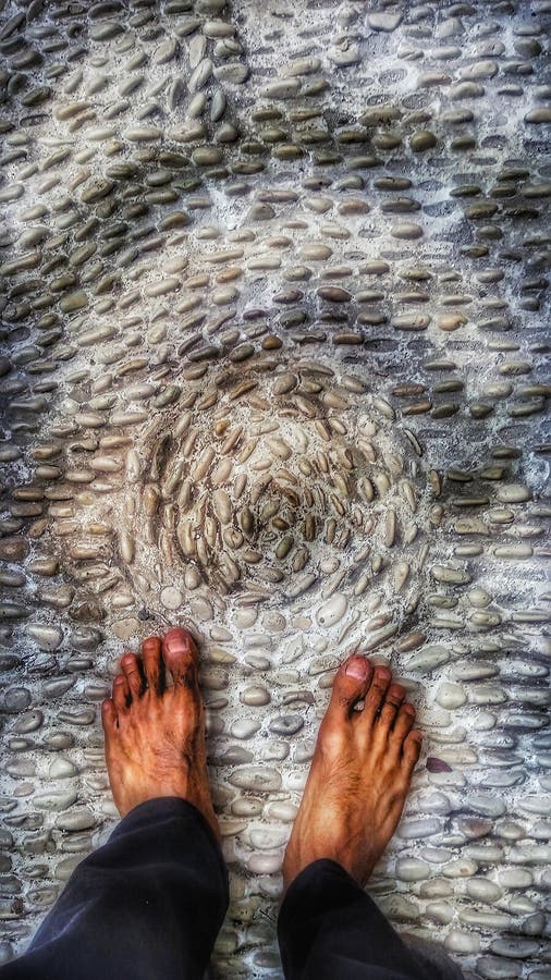 A Pair of Feet on a Floor with a Unique Texture and Edited Colors Stock ...