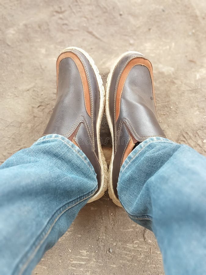 A Pair of Feet Wearing Brown Shoes Stock Image - Image of brown ...