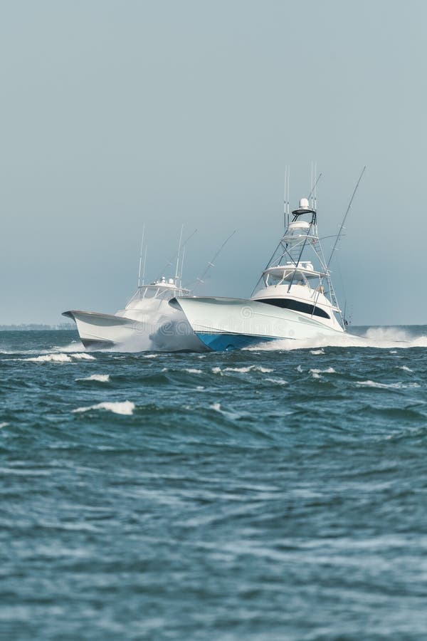 Pair of Fishing Vessels Navigating through the Choppy Waters of the ...