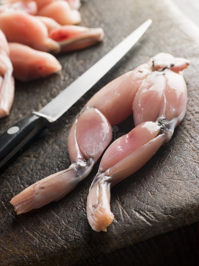 Pair of Fresh Frog Legs stock photo. Image of meal, cookery - 5617766