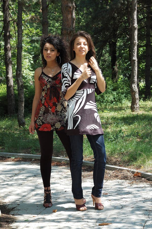 Pair of girls on walkway stock image. Image of path, clothing - 5718017