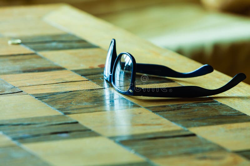Pair of Glasses on a Checkered Table Stock Image - Image of reading ...