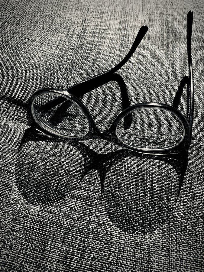 A Pair of Glasses Left on the Sofa Stock Photo - Image of shoe, worn ...