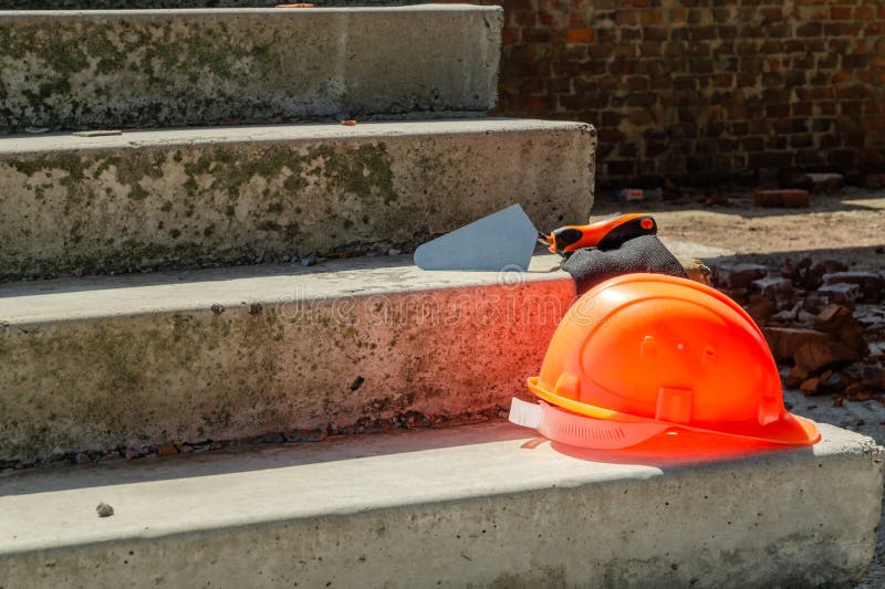 A Pair of Gloves and a Mason`s Helmet at the Construction Stock Photo ...